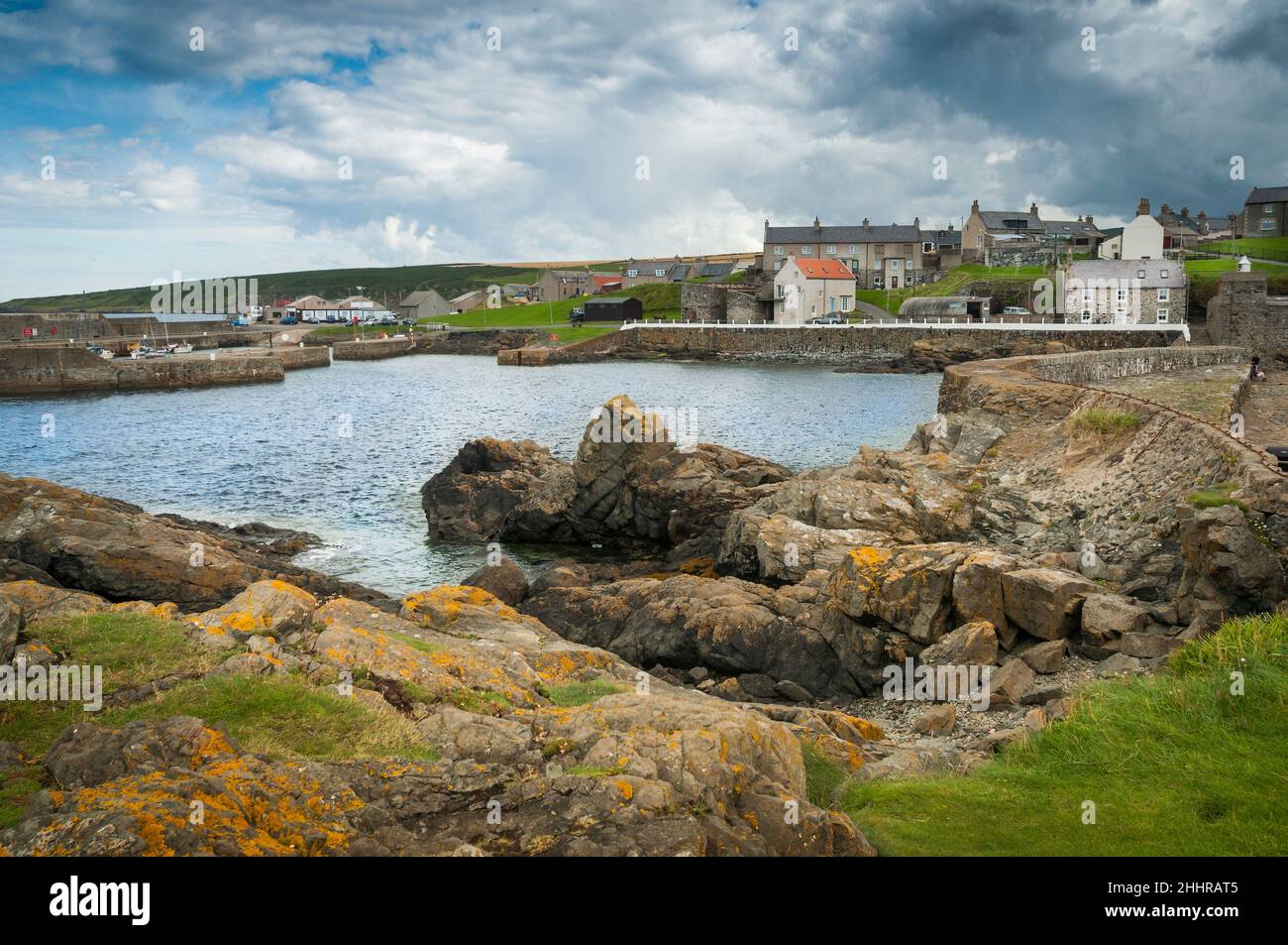 Landscape view of a small coastal village in Scotland with rocks and ...
