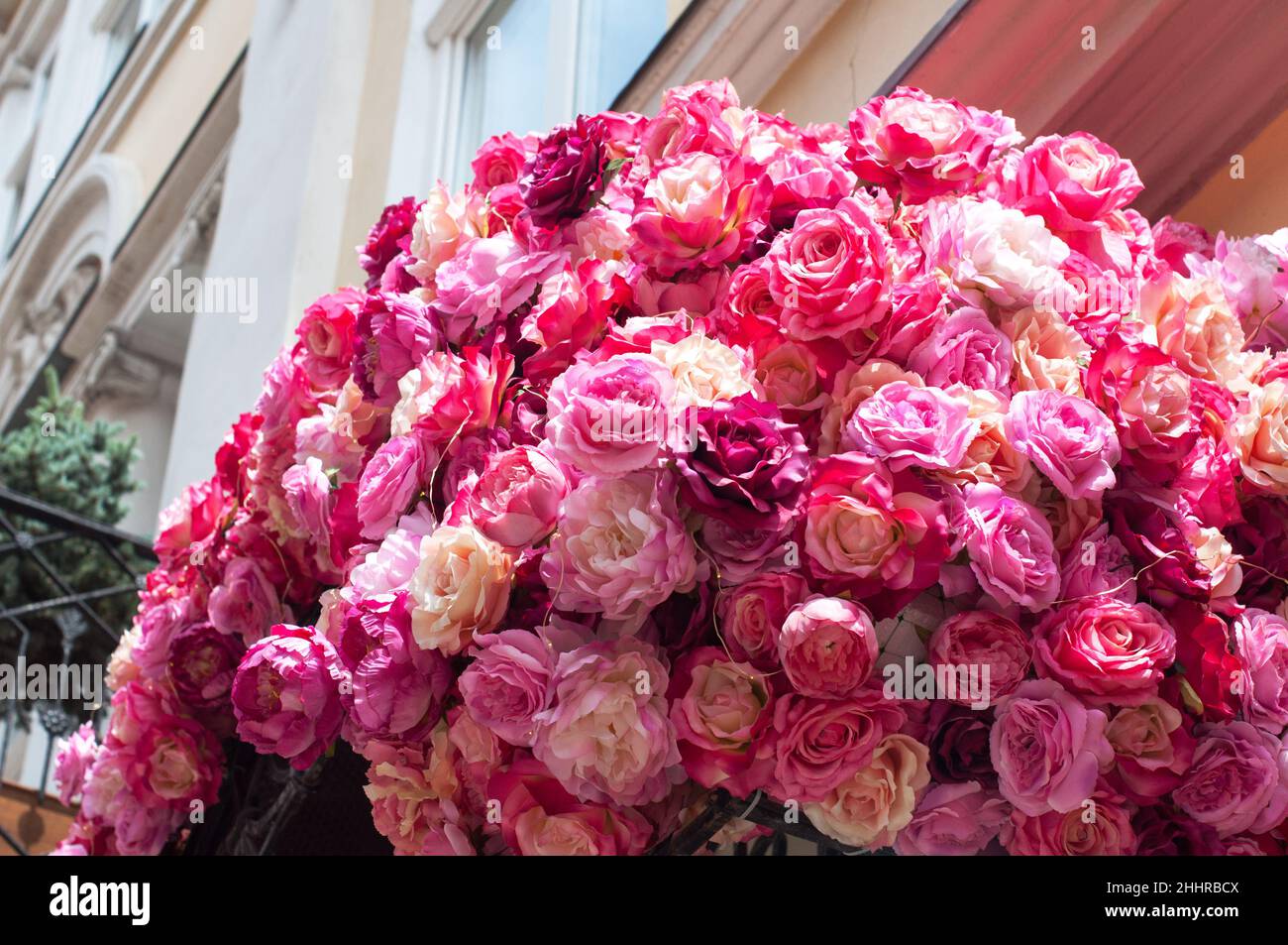 Beautiful flowers on buildings in town Stock Photo - Alamy