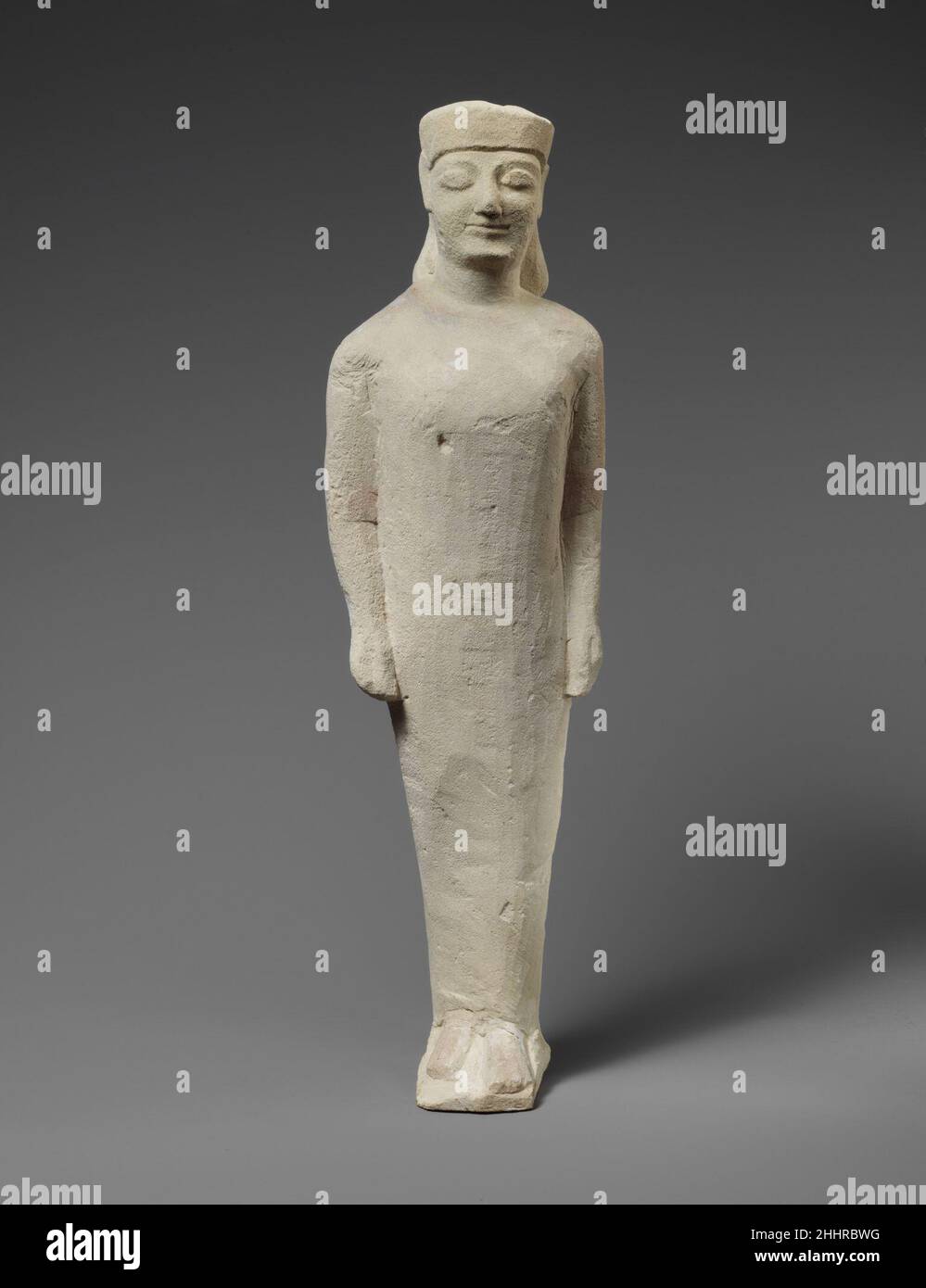 Limestone statuette of a beardless male votary in Greek dress 6th ...
