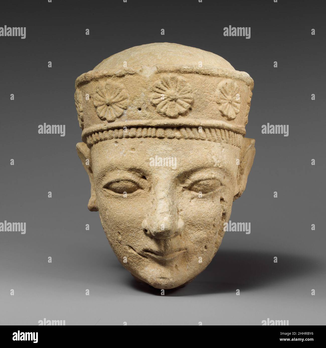 Limestone head of a beardless male with a diadem first half the the 6th ...