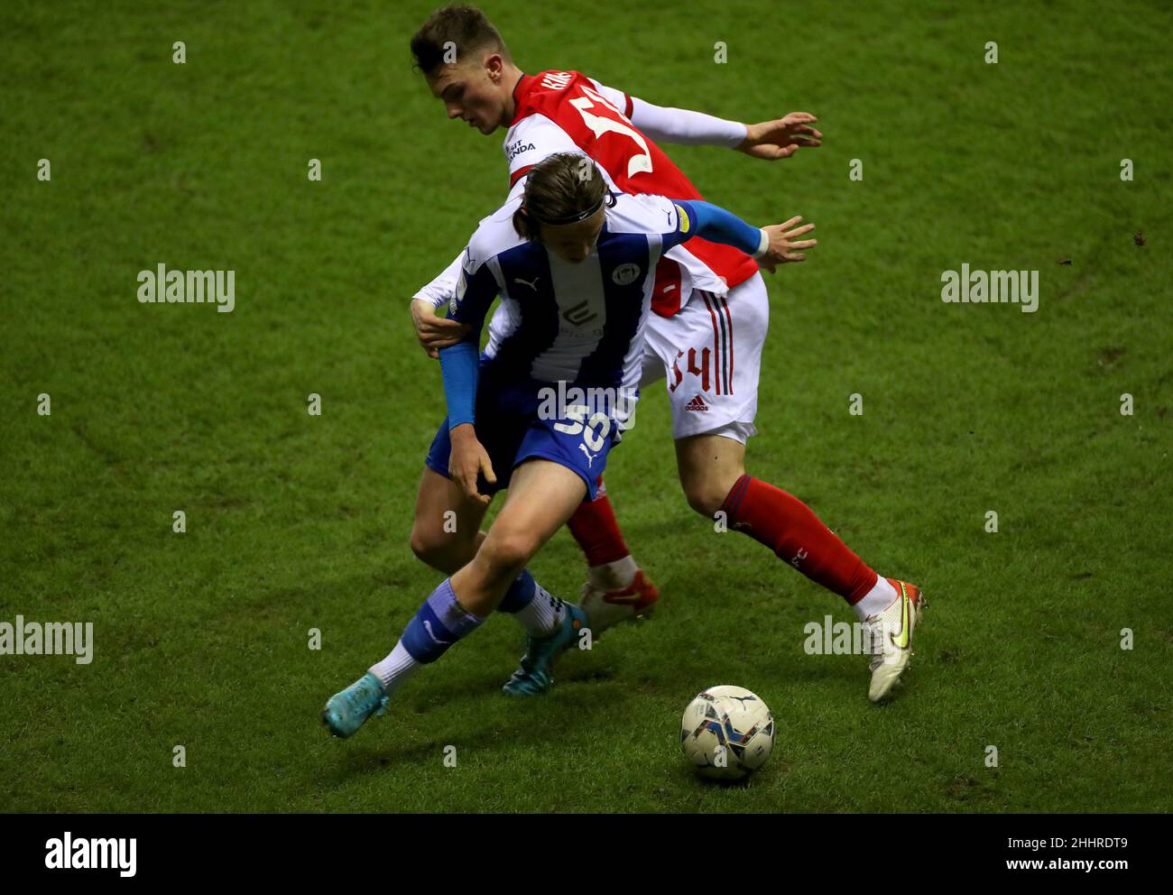 Wigan Athletic's Thelo Aasgaard (left) and Arsenal's Alex Kirk battle ...
