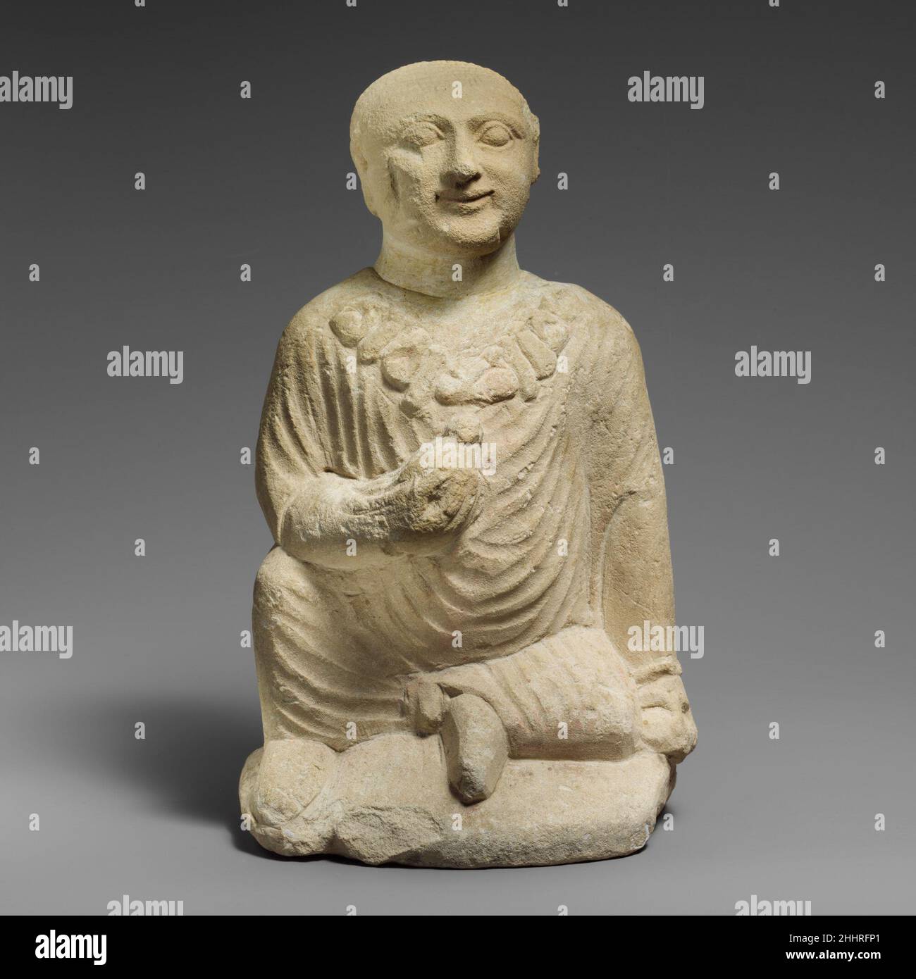 Limestone statuette of a temple boy 4th century B.C. Cypriot Seated ...
