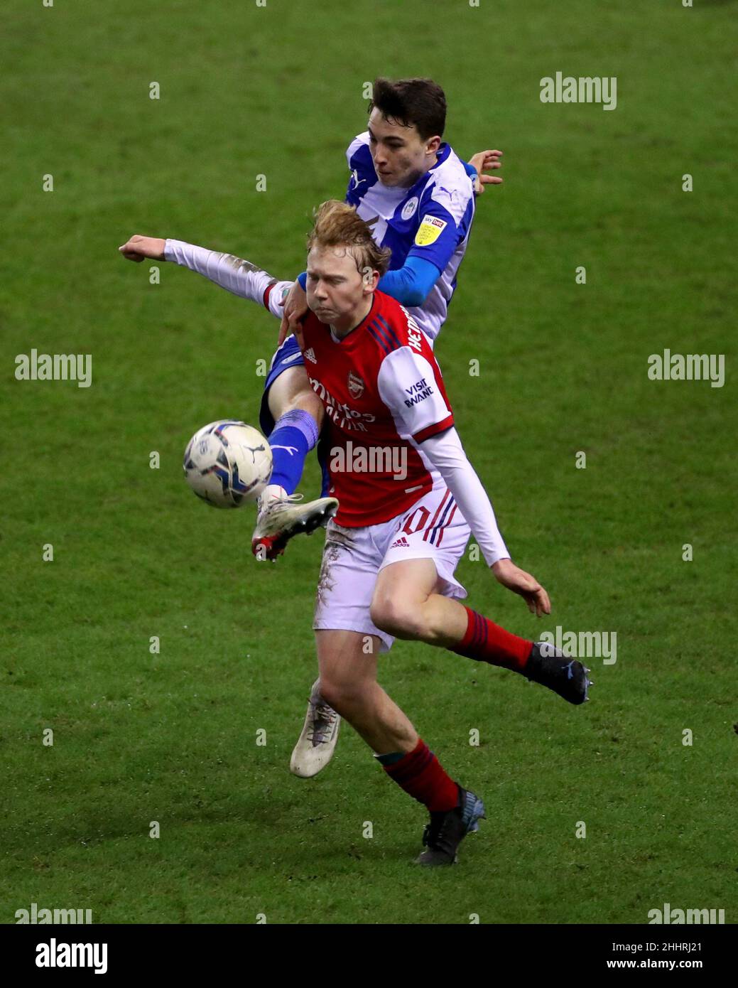 Arsenal's Jack Francis and Wigan Athletic's Chris Sze battle for the ...