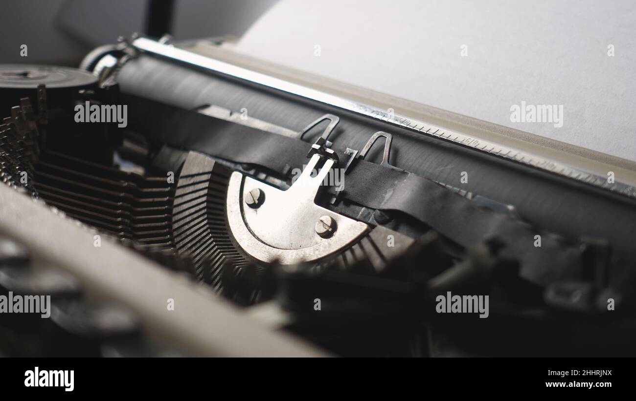 An author working on an old retro mechanical typewriter Stock Photo - Alamy