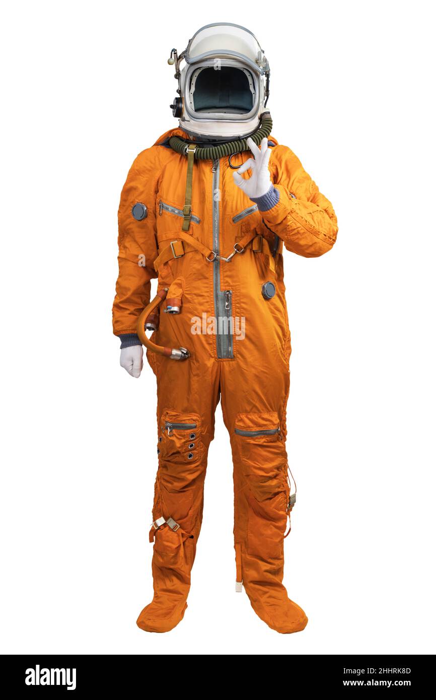Astronaut wearing an orange spacesuit and helmet showing hand OK sign ...