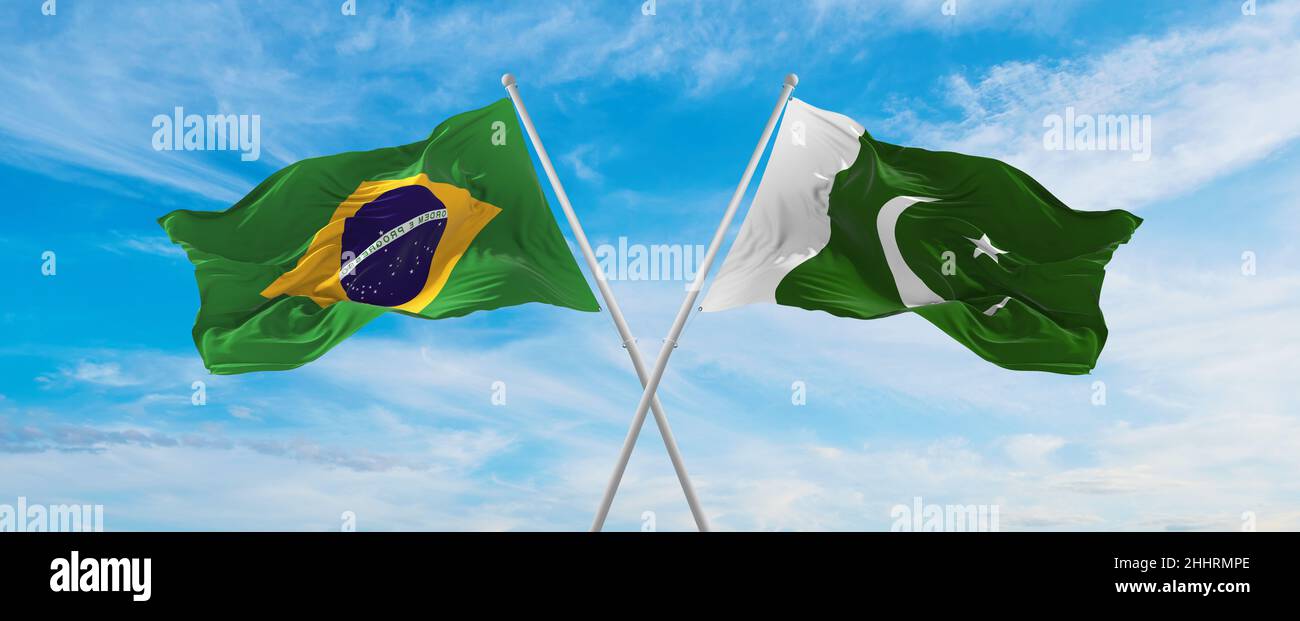 crossed national flags of Brazil and Pakistan flag waving in the wind ...
