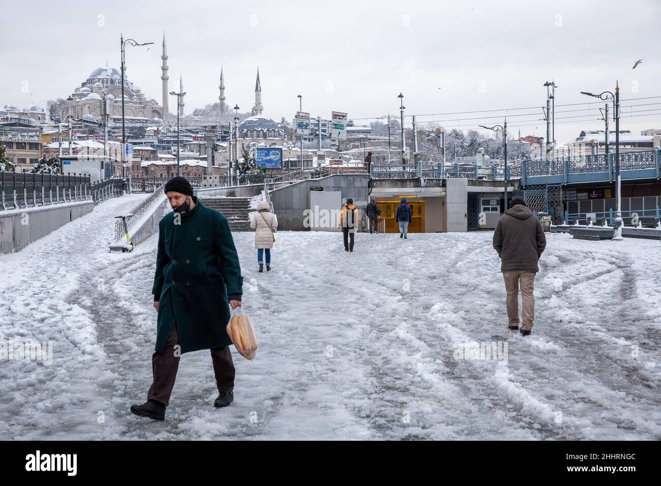 People walking in the snow in Eminonu district in Istanbul, Turkey on ...