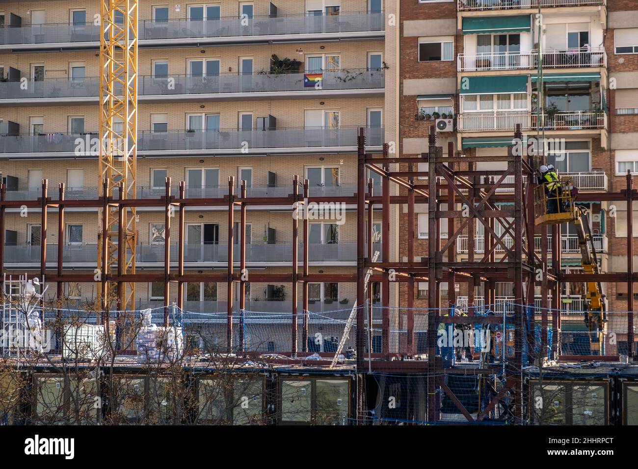 A first line of maritime containers forming the first floor are seen as ...