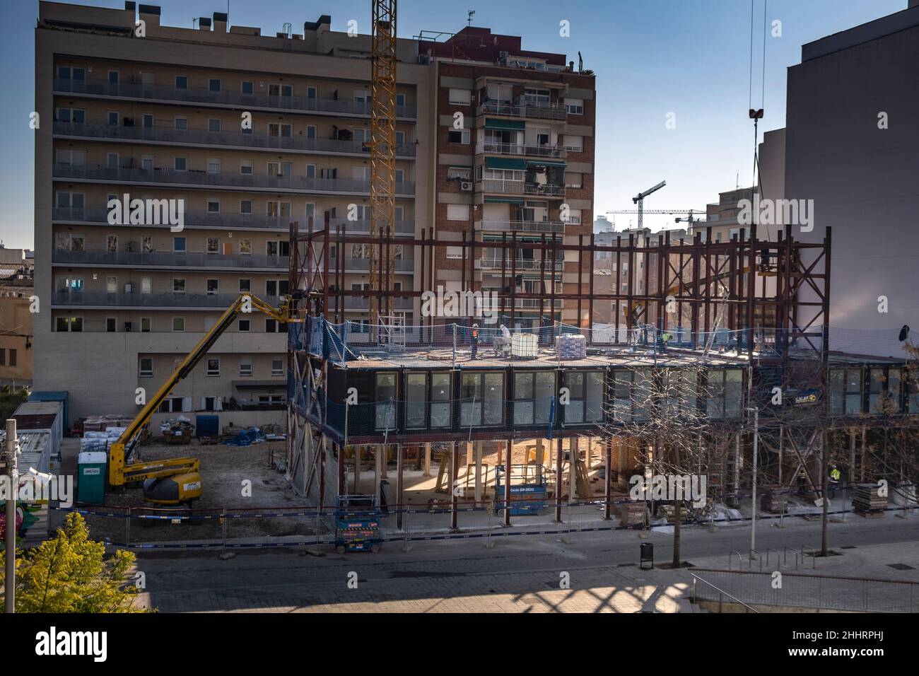 A first line of maritime containers forming the first floor are seen as ...