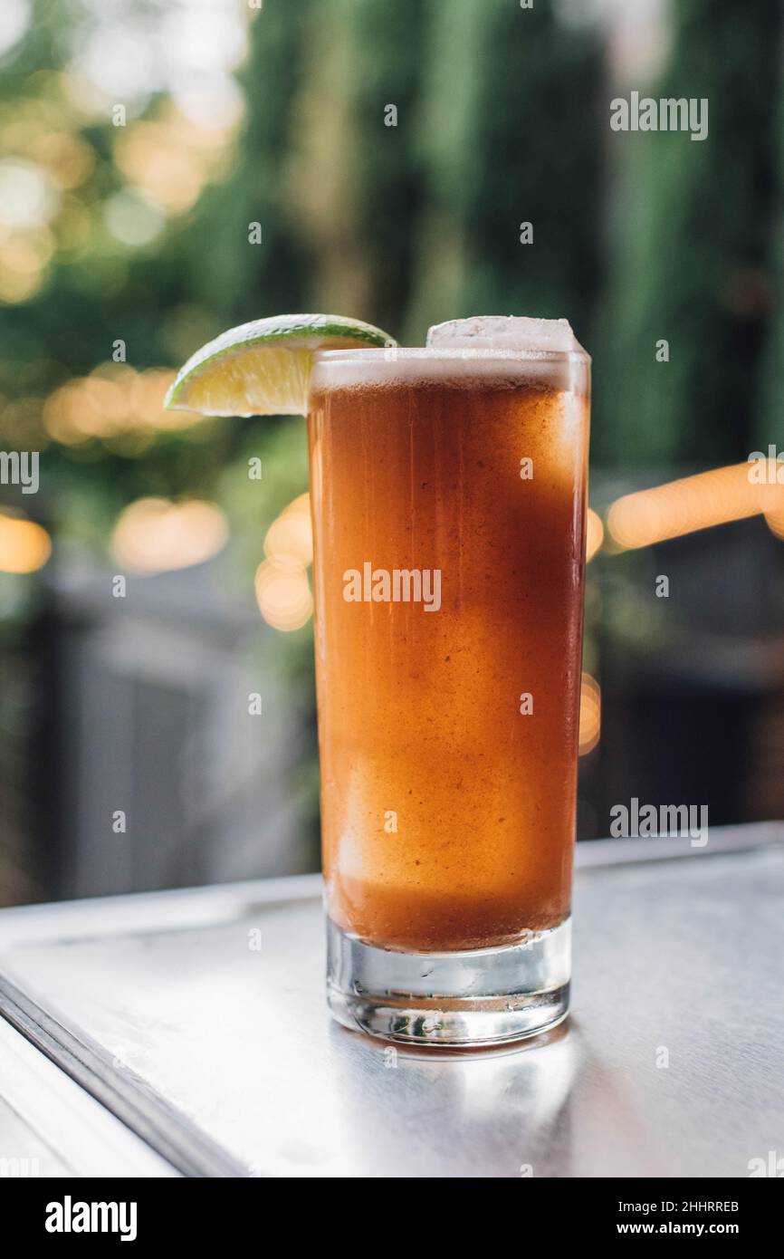 tamarind whiskey sour cocktail on ice with lime Stock Photo - Alamy