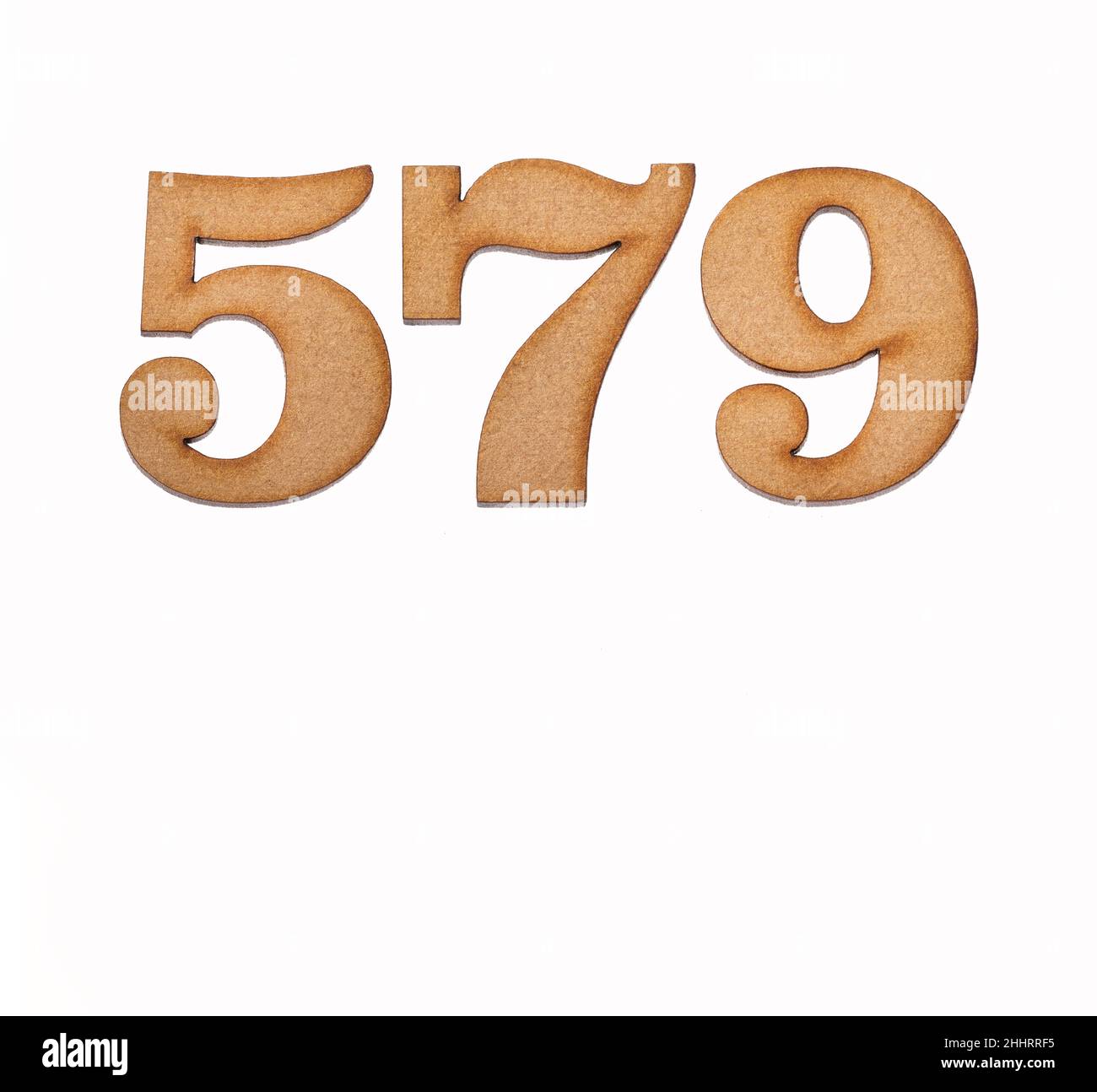 Number 579 in wood, isolated on white background Stock Photo - Alamy