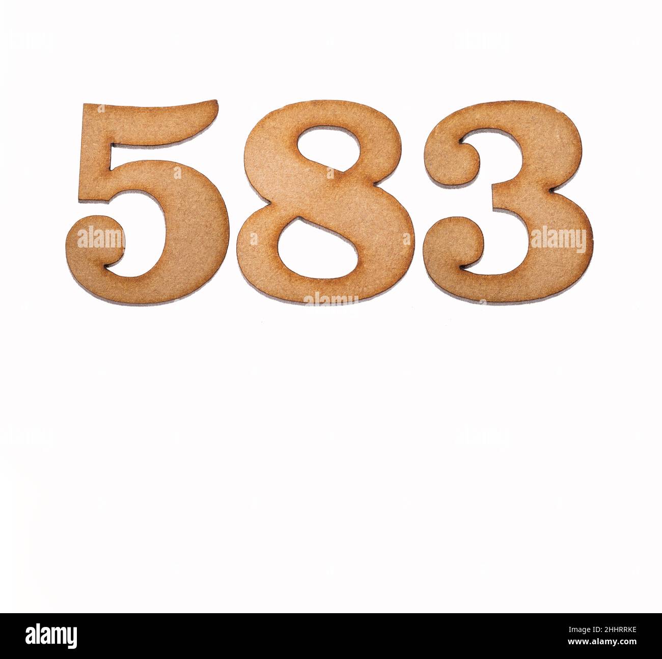 Number 583 in wood, isolated on white background Stock Photo - Alamy