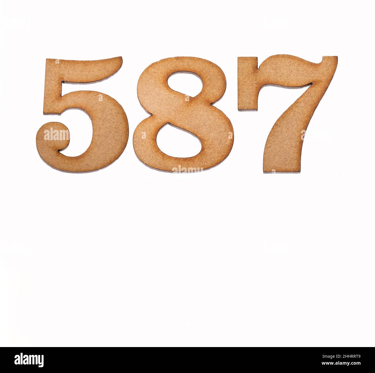 Number 587 in wood, isolated on white background Stock Photo - Alamy