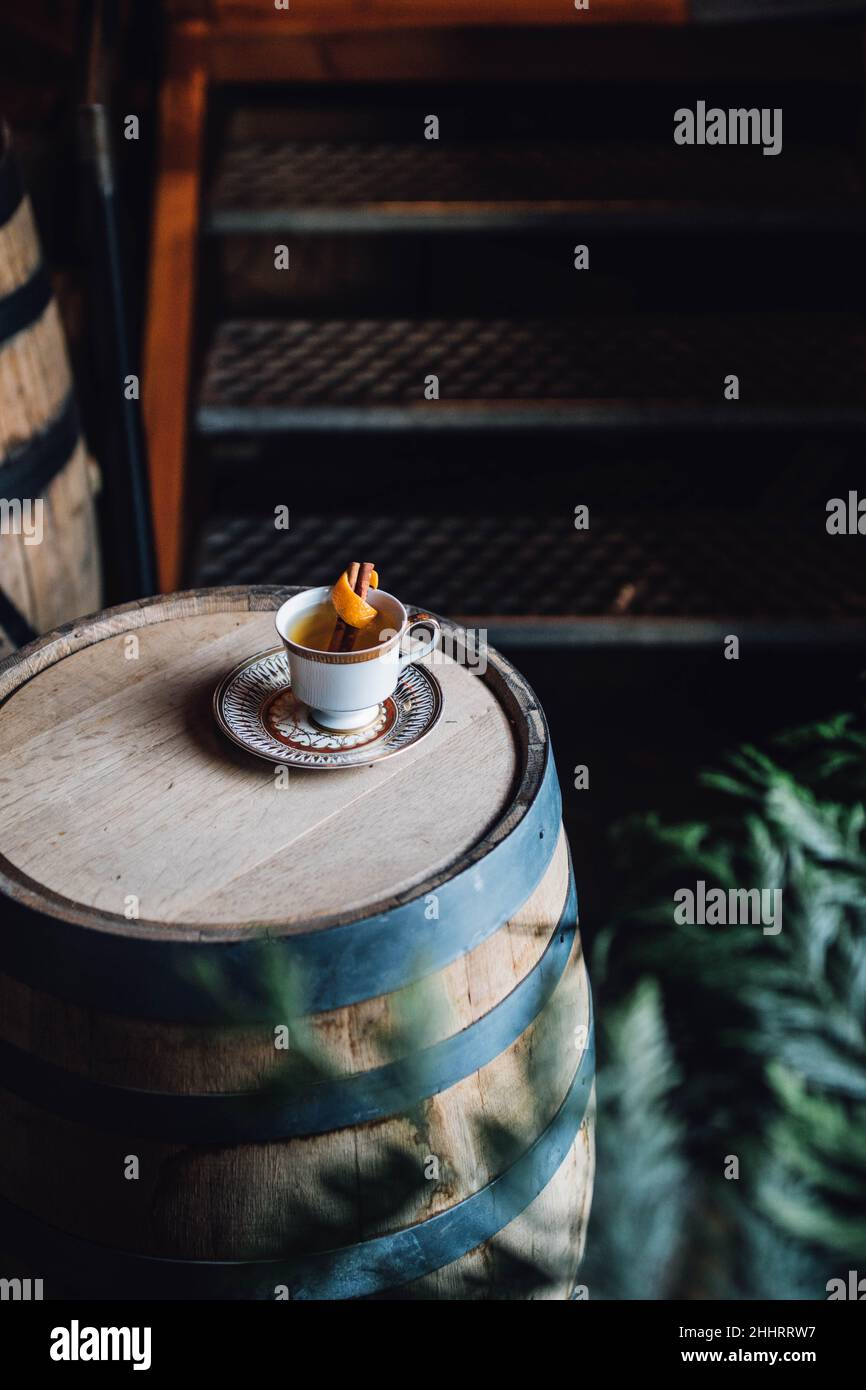 hot toddy with orange in teacup on whiskey barrel Stock Photo - Alamy