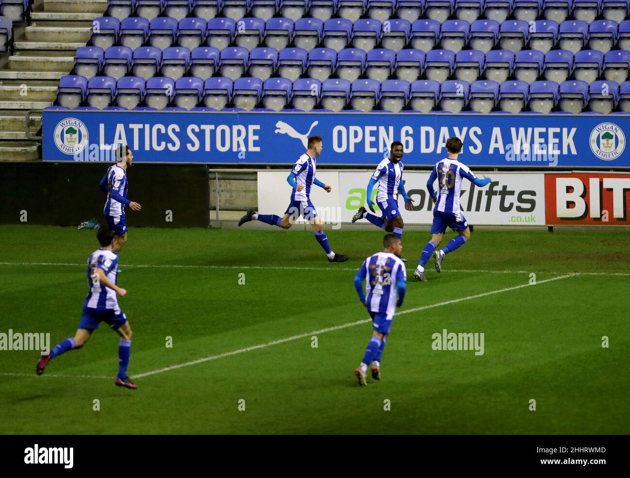 Wigan Athletic's Divin Baningime celebrates scoring their side's first ...