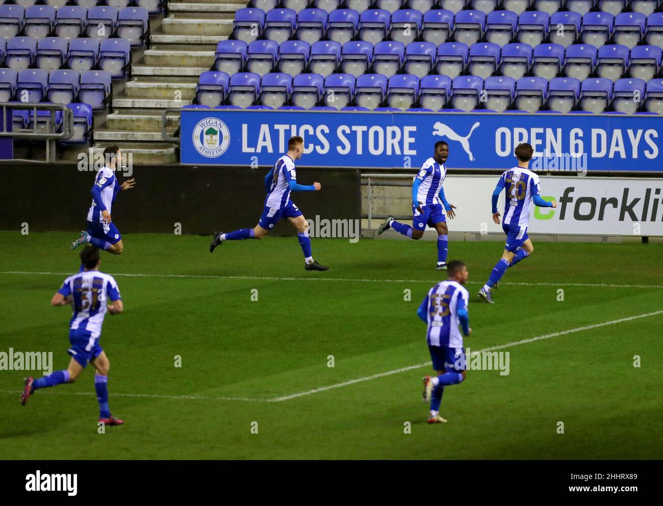 Wigan Athletic's Divin Baningime celebrates scoring their side's first ...