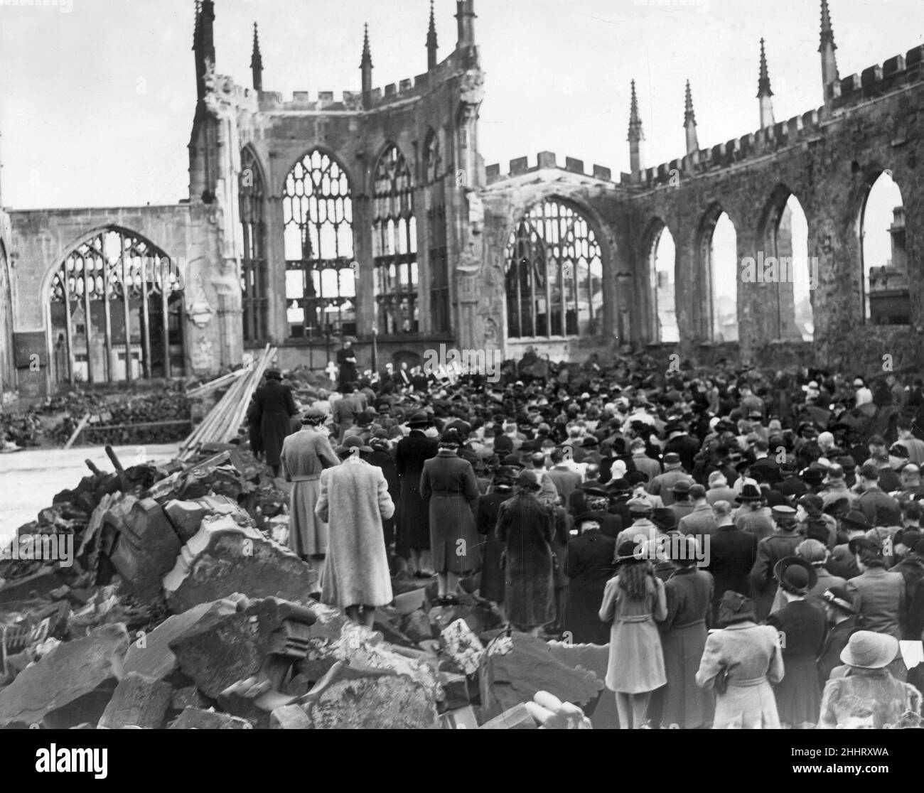Crowds gather for a remembrance service inside the ruins of Coventry ...