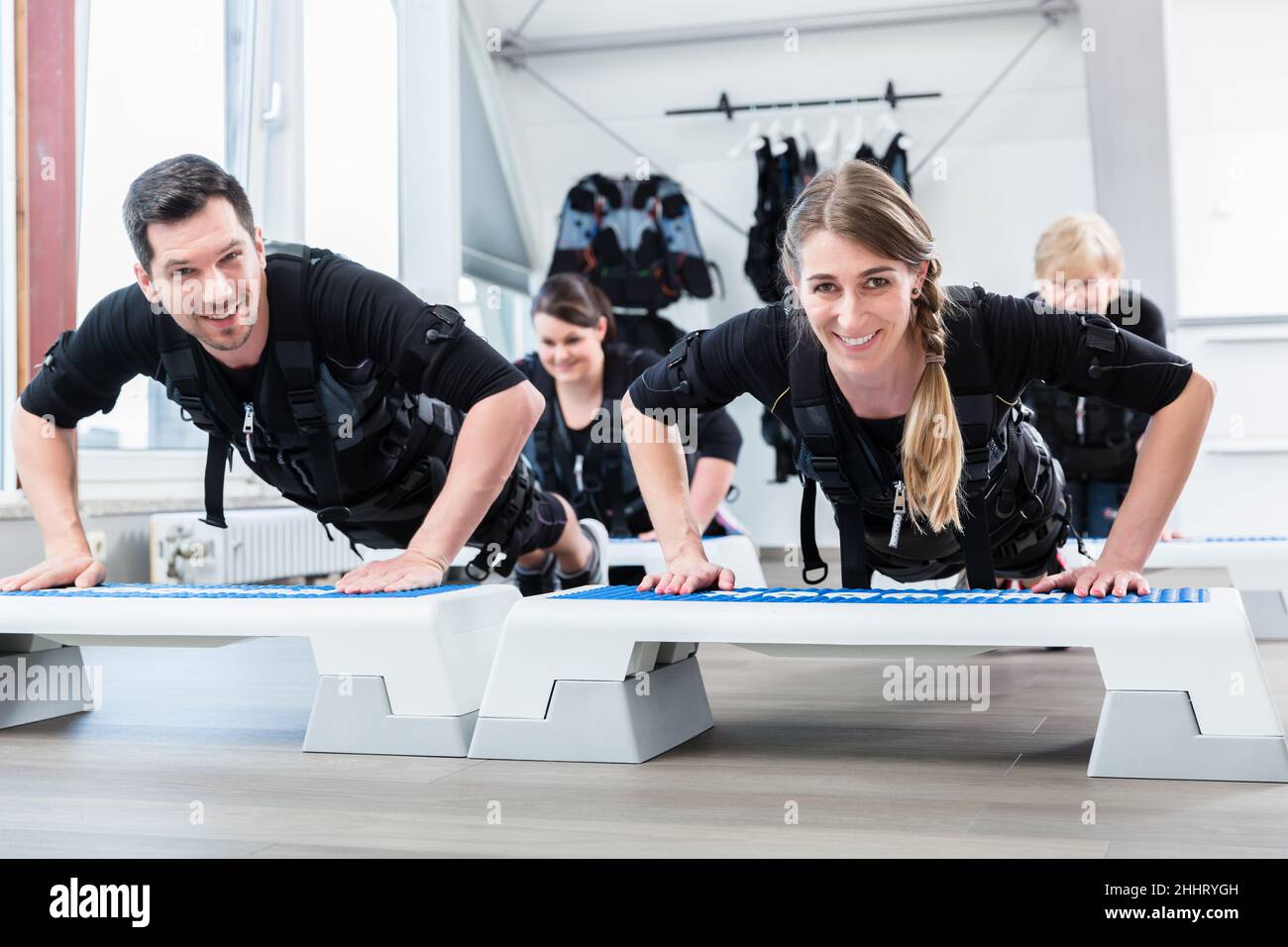 Pushups and core exercise in wireless ems gym Stock Photo - Alamy