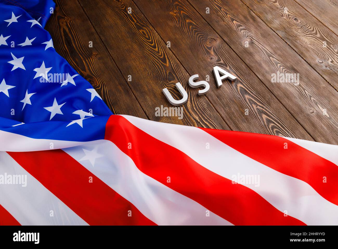 the word USA laid with silver metal letters on wooden board surface ...