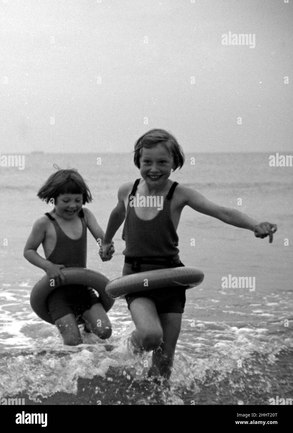 Summer Holidays, children p[addling in the English Channel at Hove ...