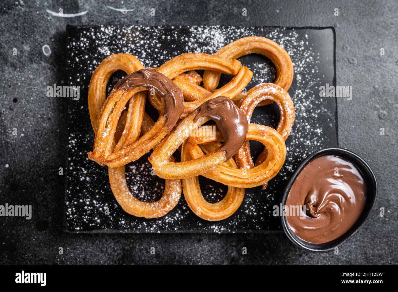 Traditional mexican dessert churros with chocolate sause. Black ...