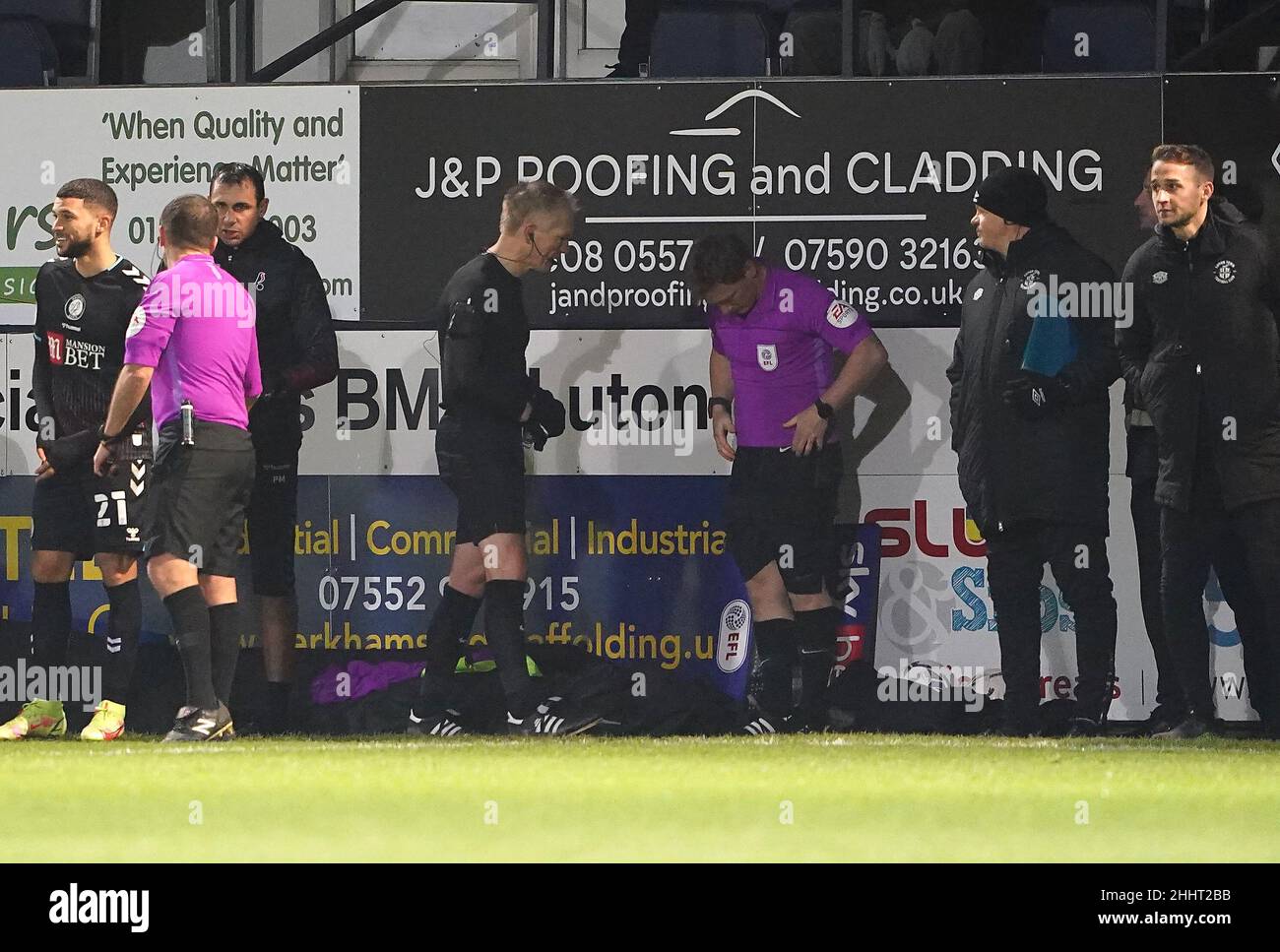 Assistant referee Michael George (left) is replaced for fourth official ...