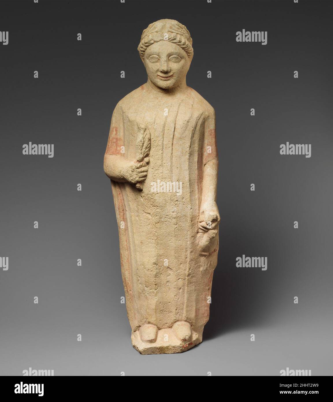 Limestone statuette of a boy holding a bird and a branch of leaves 5th ...