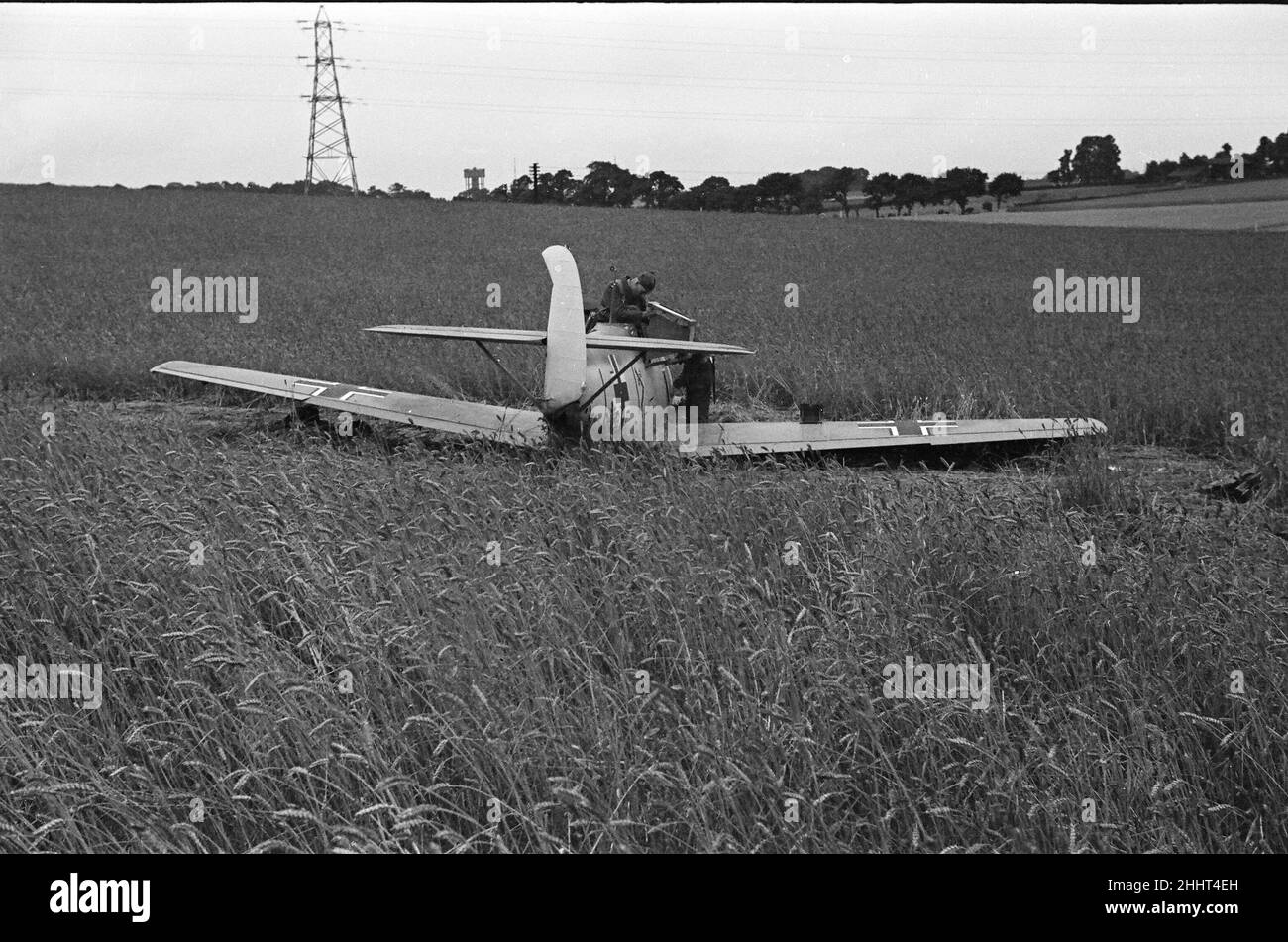Members of the RAF technical team examine a downed Messerschmitt BF109 ...