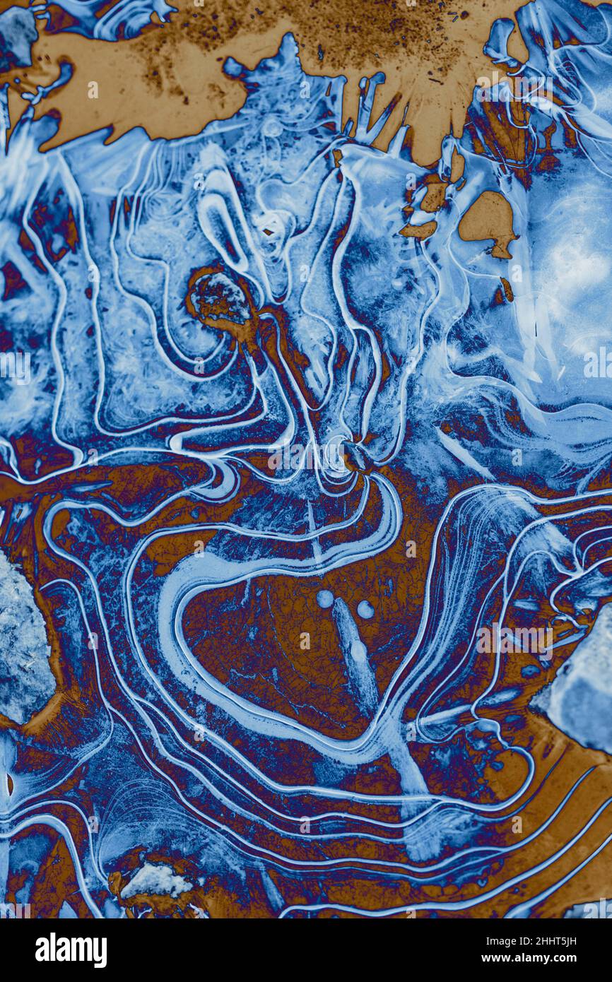 Mixing of blue and orange liquid marble oil paints abstract textured ...