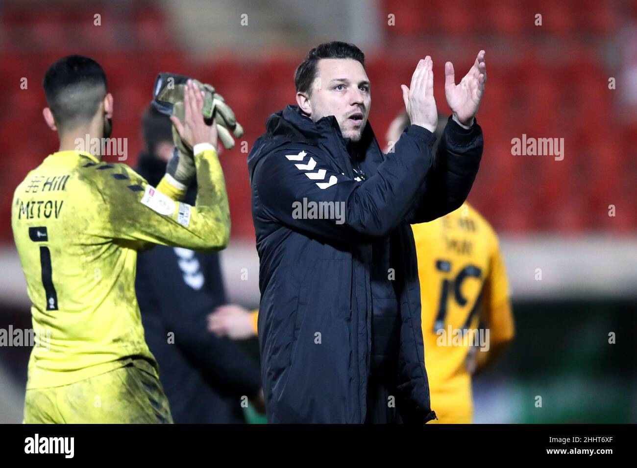 Cambridge United manager Mark Bonner applauds the fans following the ...