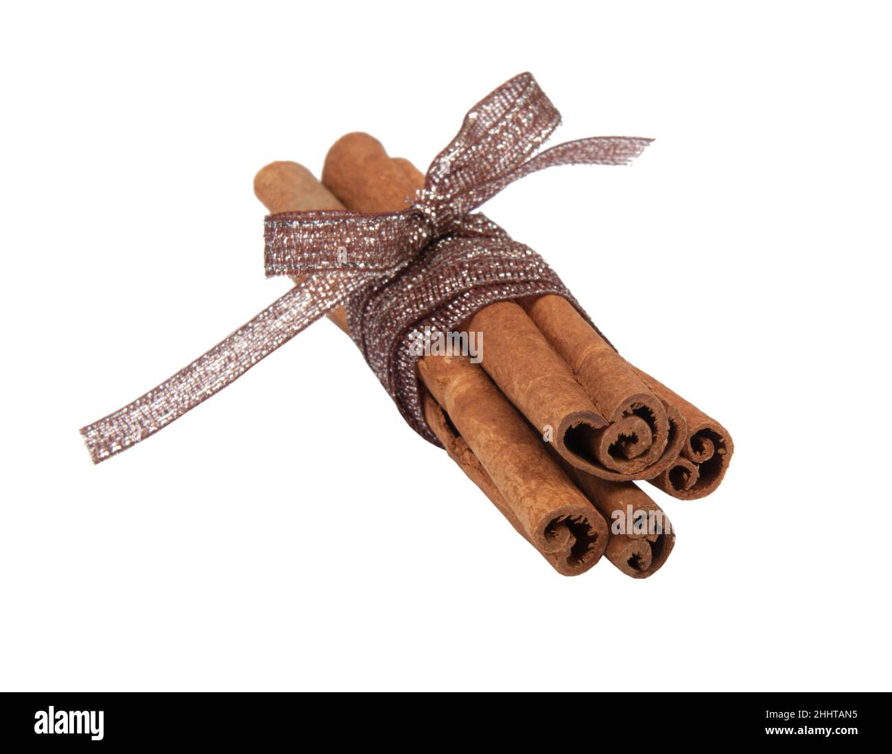 Cinnamon sticks with ribbon isolated on the white Stock Photo - Alamy