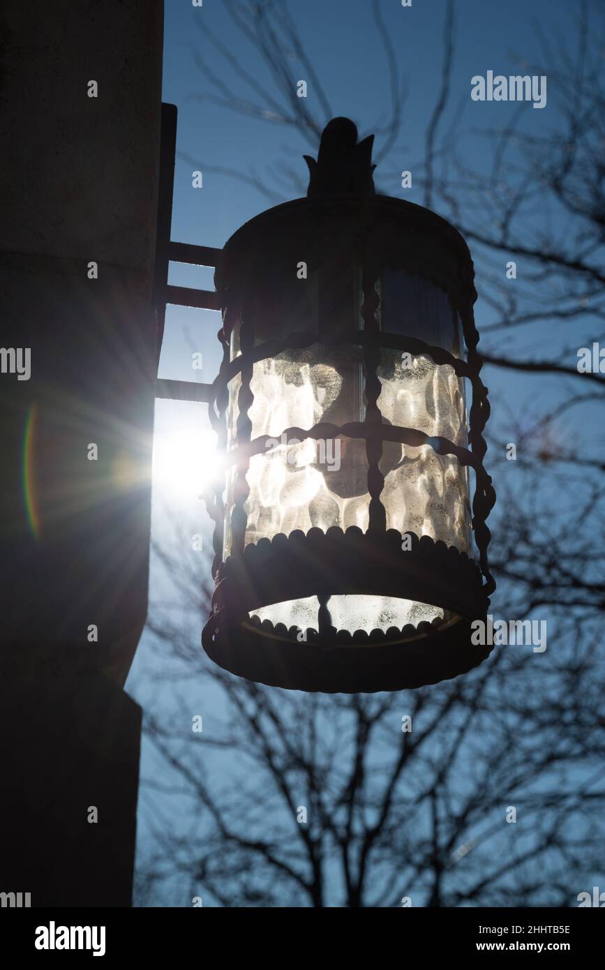 Outdoor lantern backlit by shing sun and sun flare Stock Photo - Alamy