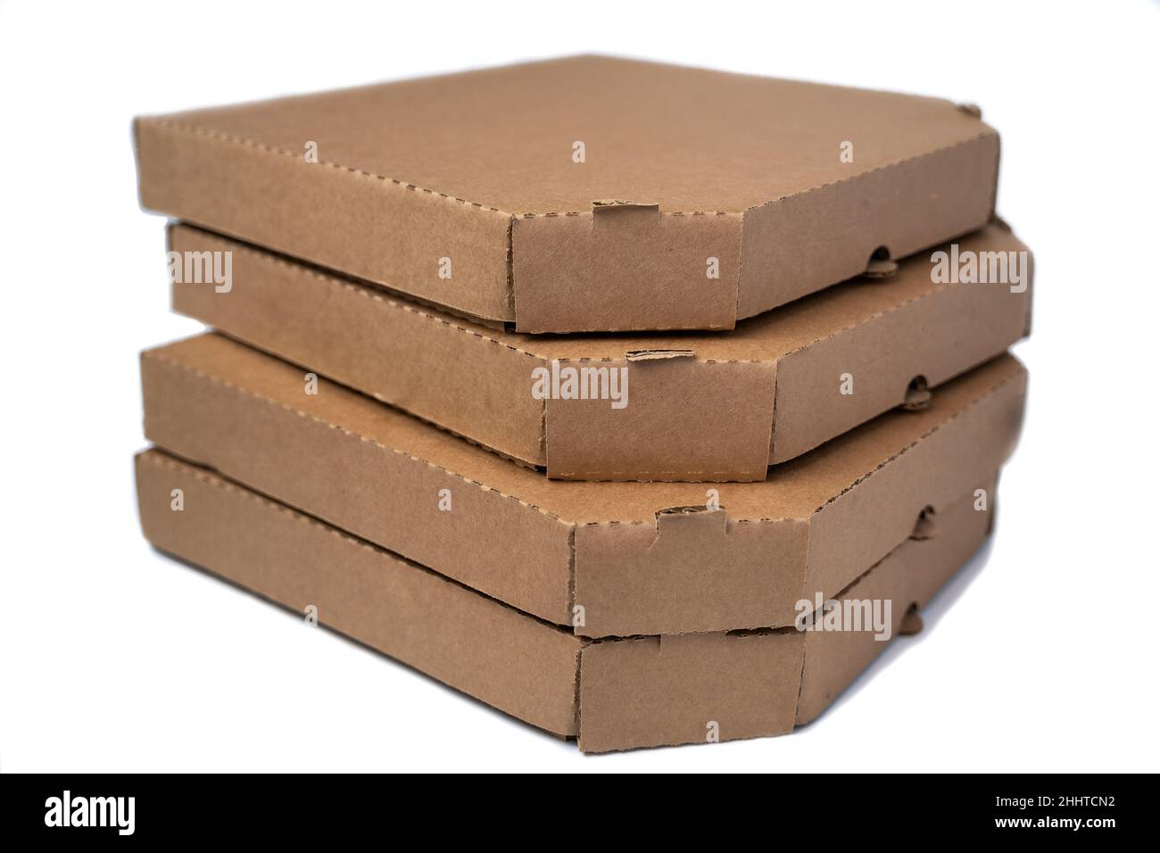 Stack flat brown cardboard pizza boxes isolated on a white background ...