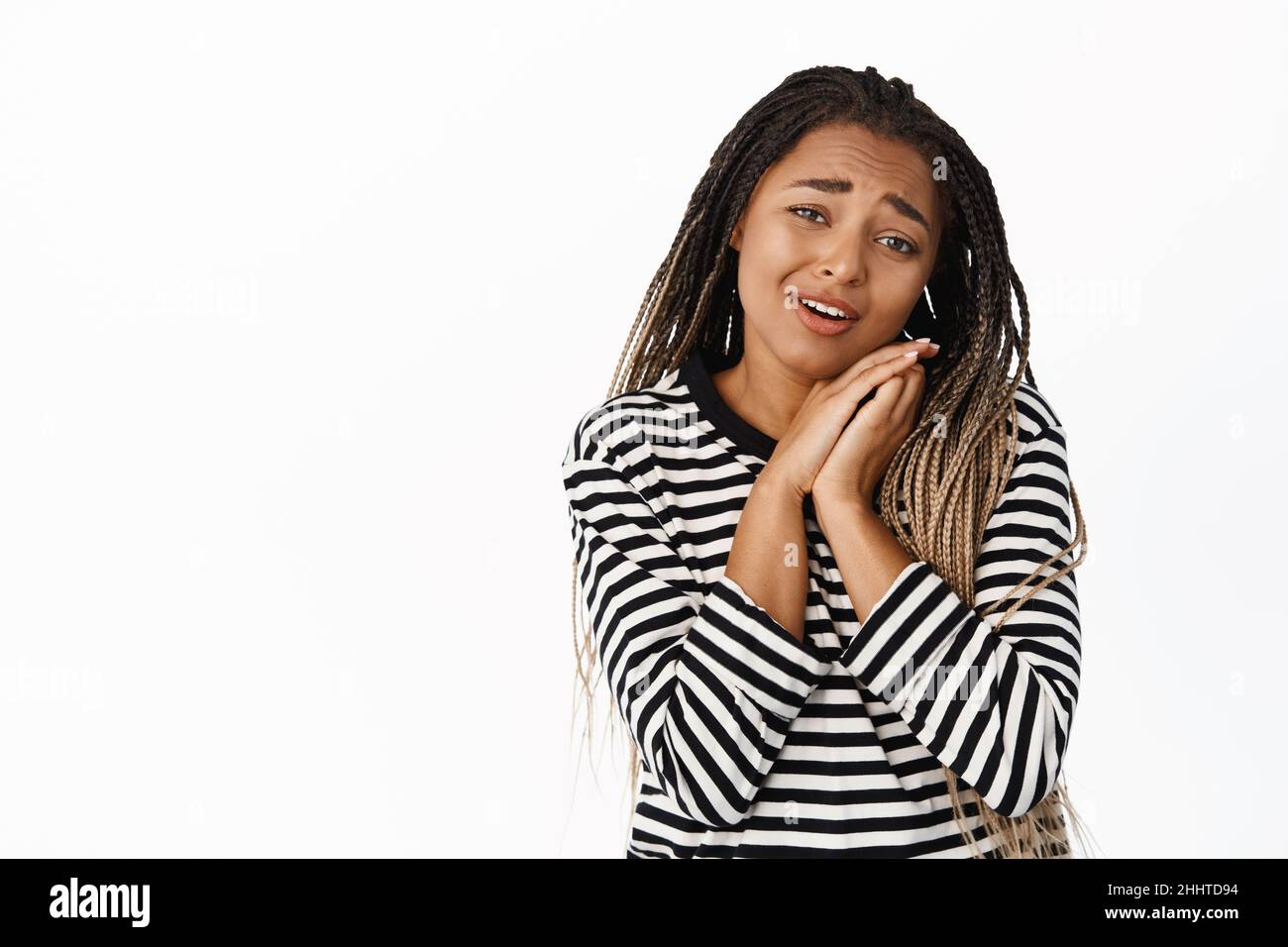 Portrait of young black woman looking at smth with care and tenderness ...