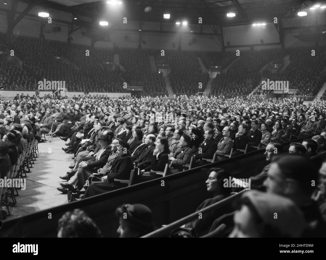 American evangelist Billy Graham speaks to the crowd at the Harringay ...