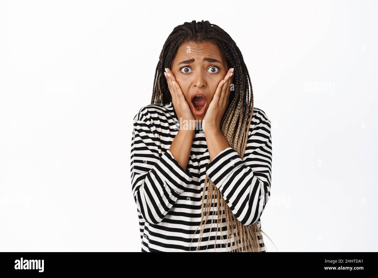 Image of shocked and terrified black woman reacting to bad concerning ...