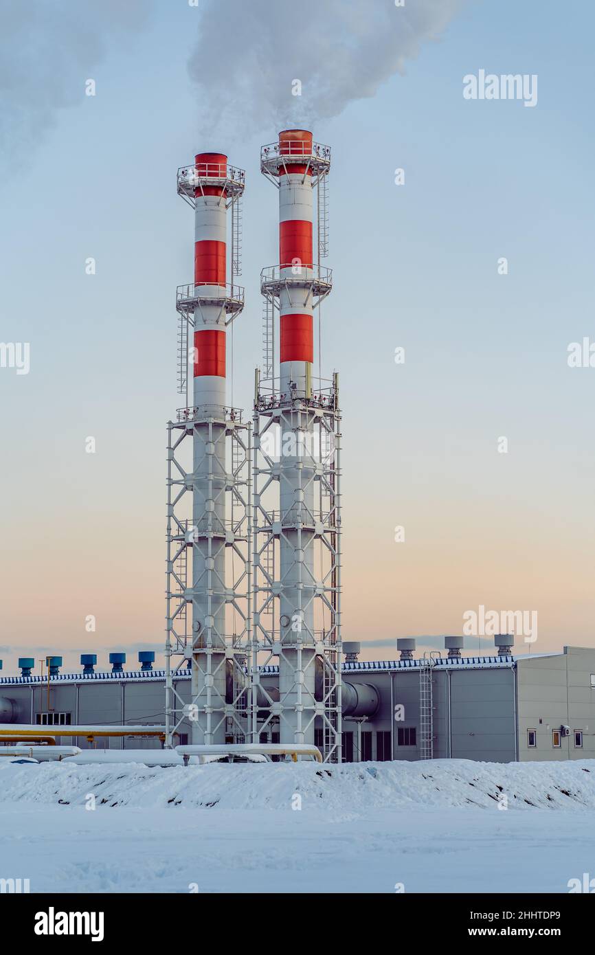 Smoking Chimneys. Factory chimneys with thick smoke against the ...