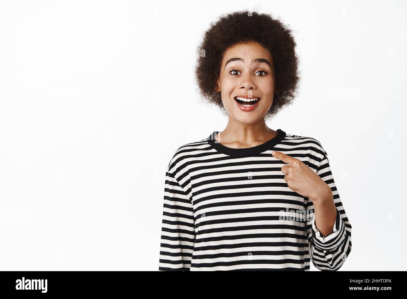 Hopeful smiling girl student pointing at herself with yearning face ...