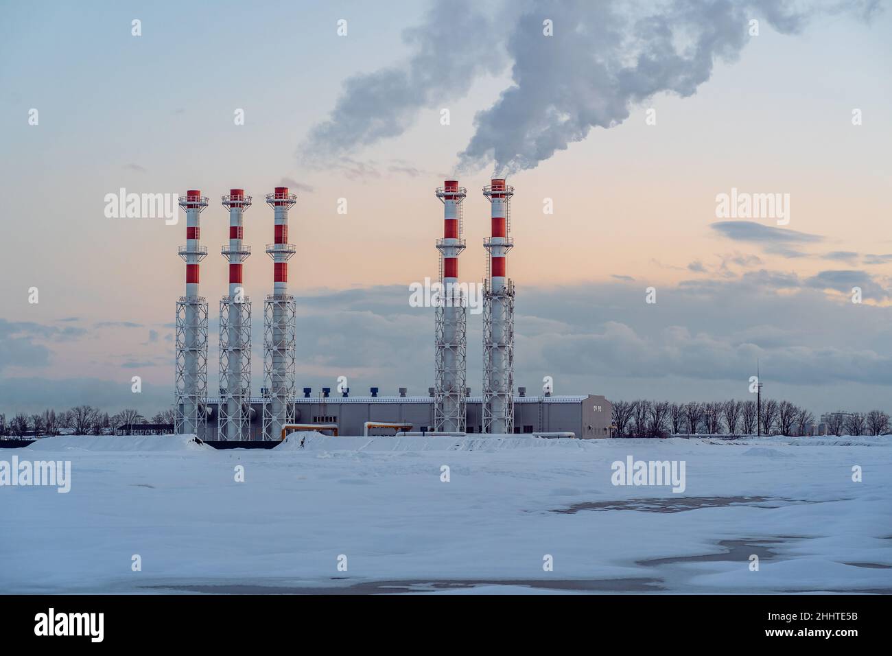 Smoking Chimneys. Factory chimneys with thick smoke against the ...
