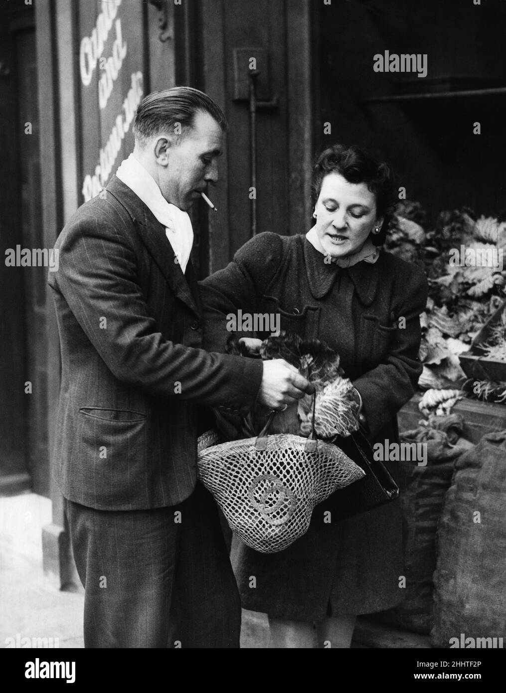 Private Ted Saunders of the 2nd Army out shopping with his wife ...