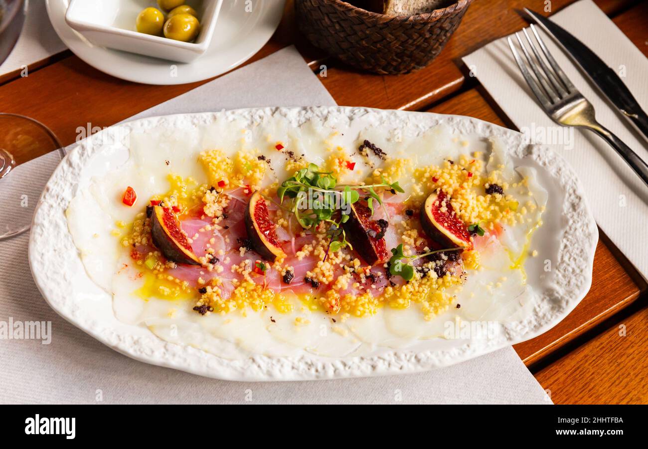 Cod carpaccio with fresh figs Stock Photo - Alamy