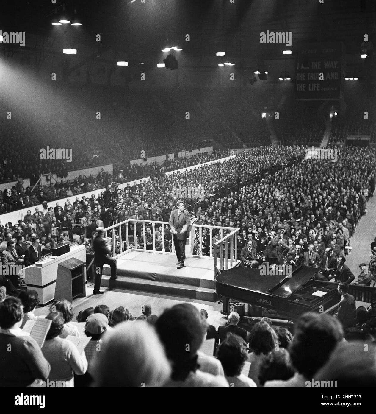 American evangelist Billy Graham speaks to the crowd at the Harringay ...