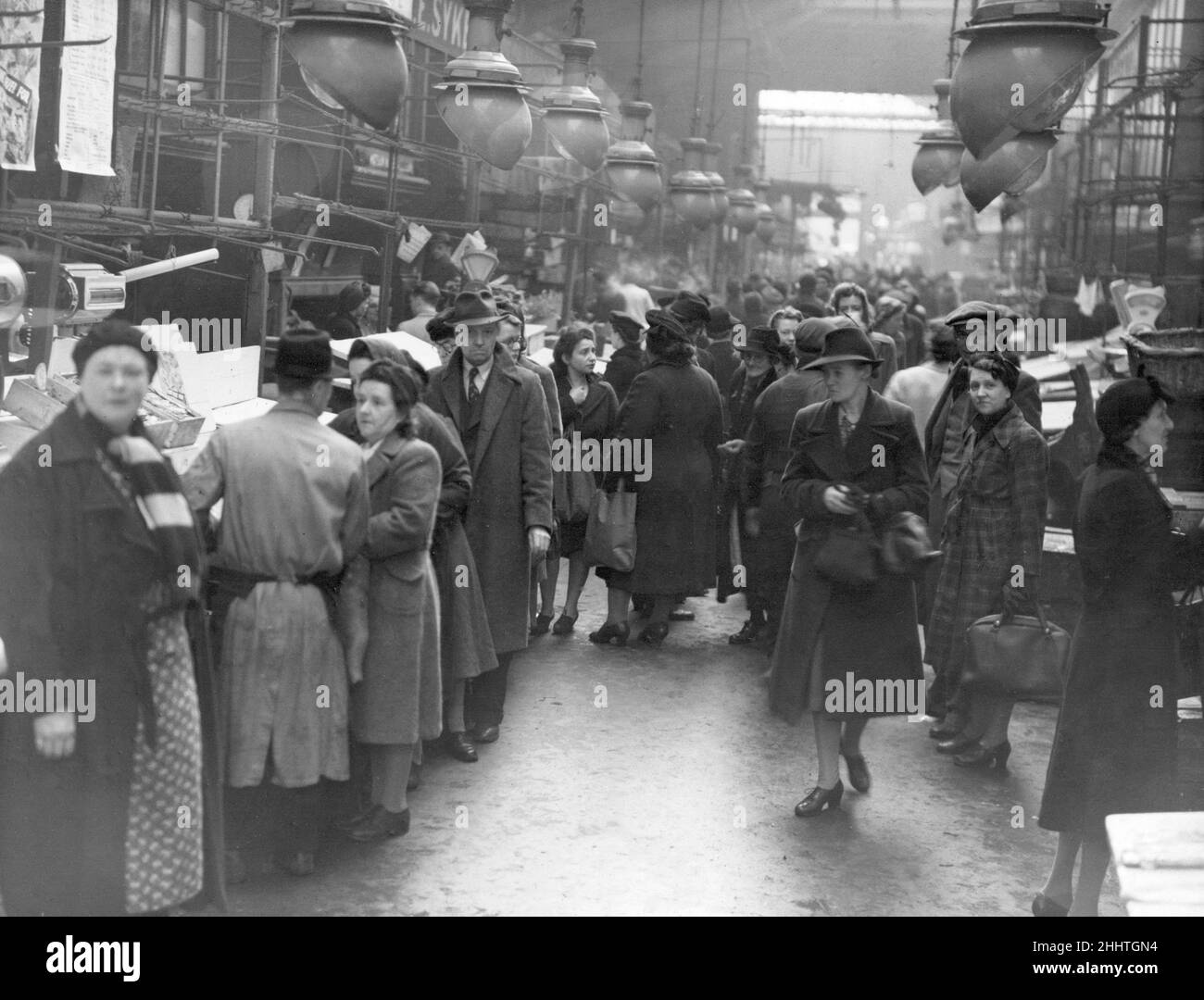 Early morning the scene in the Retail Fish Market as housewives rush ...