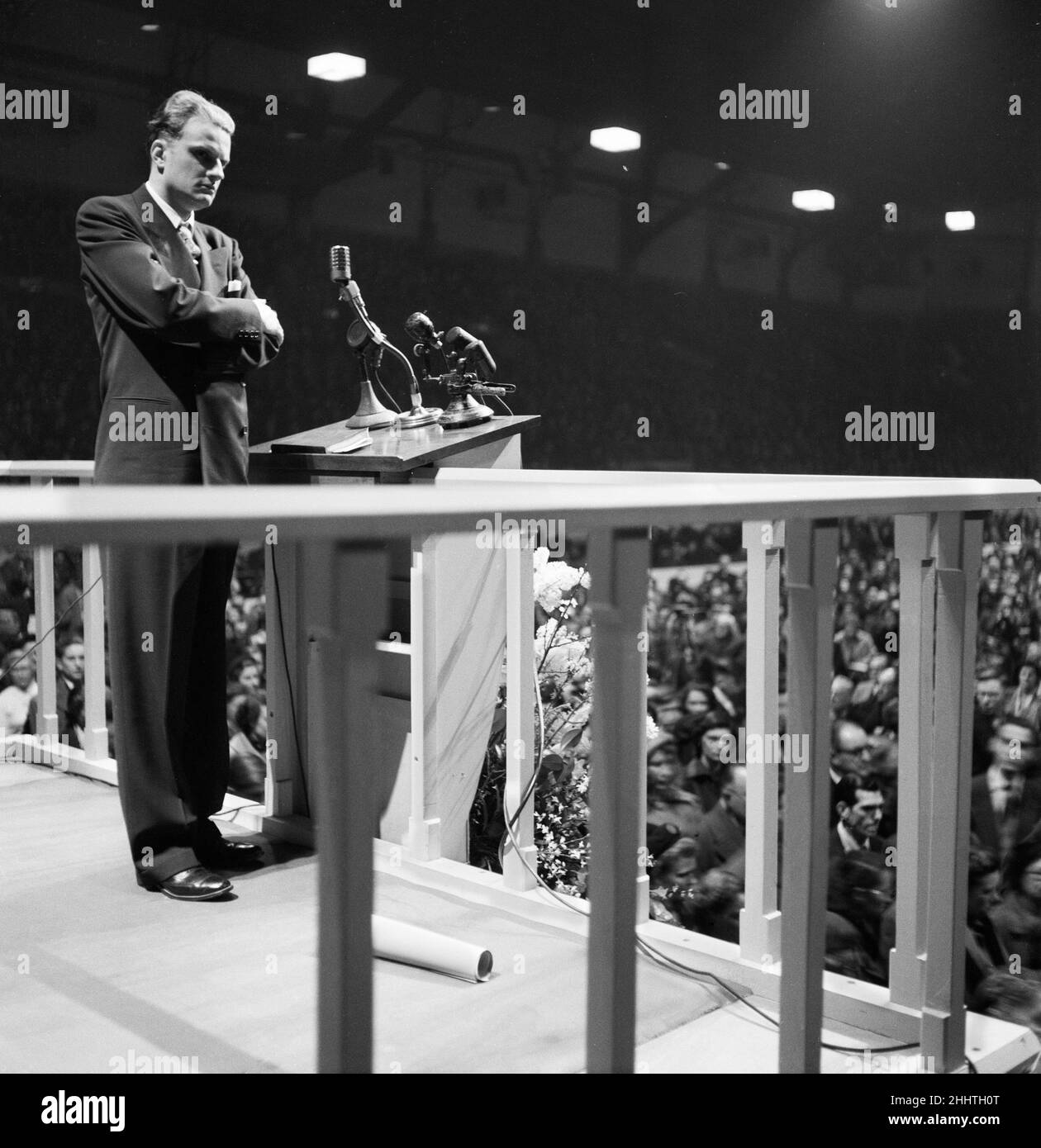 American evangelist Billy Graham speaks to the crowd at the Harringay ...