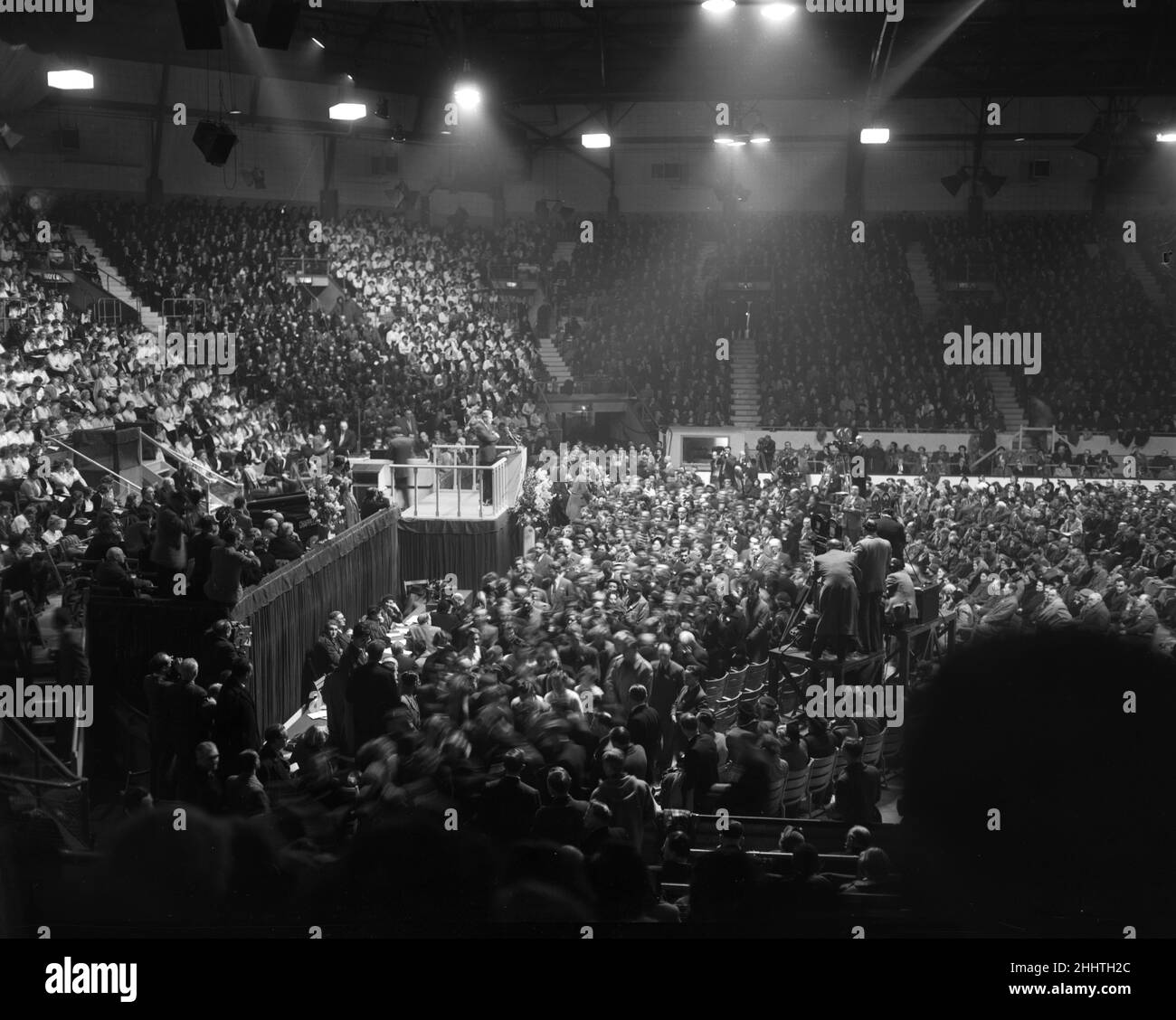 American evangelist Billy Graham speaks to the crowd at the Harringay ...