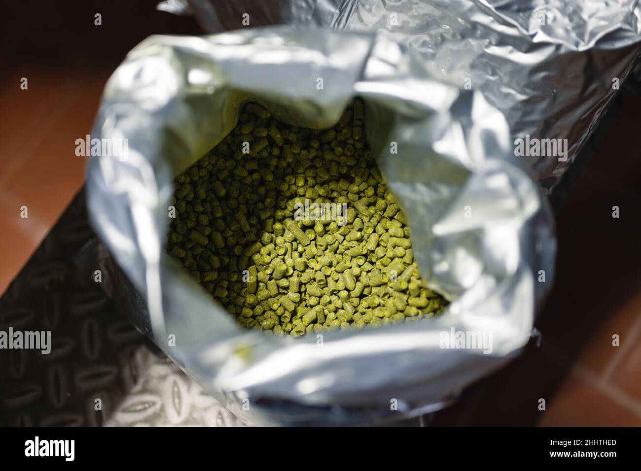 Hop pellets are packed in a plastic bag. Ingredient for brewing Stock ...