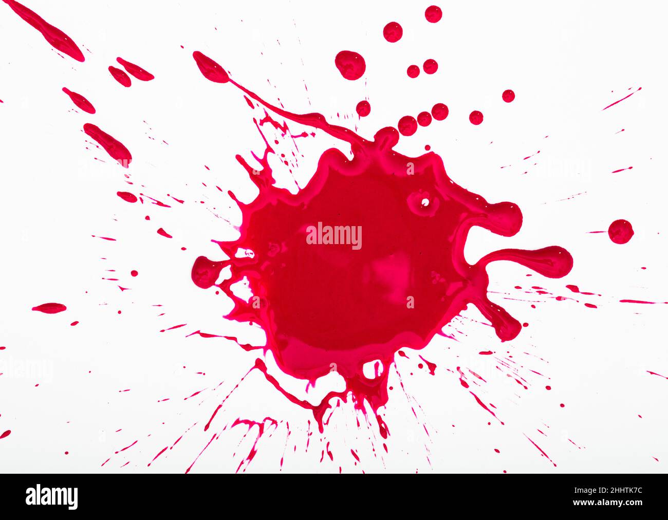 Red ink blot on white background Stock Photo - Alamy
