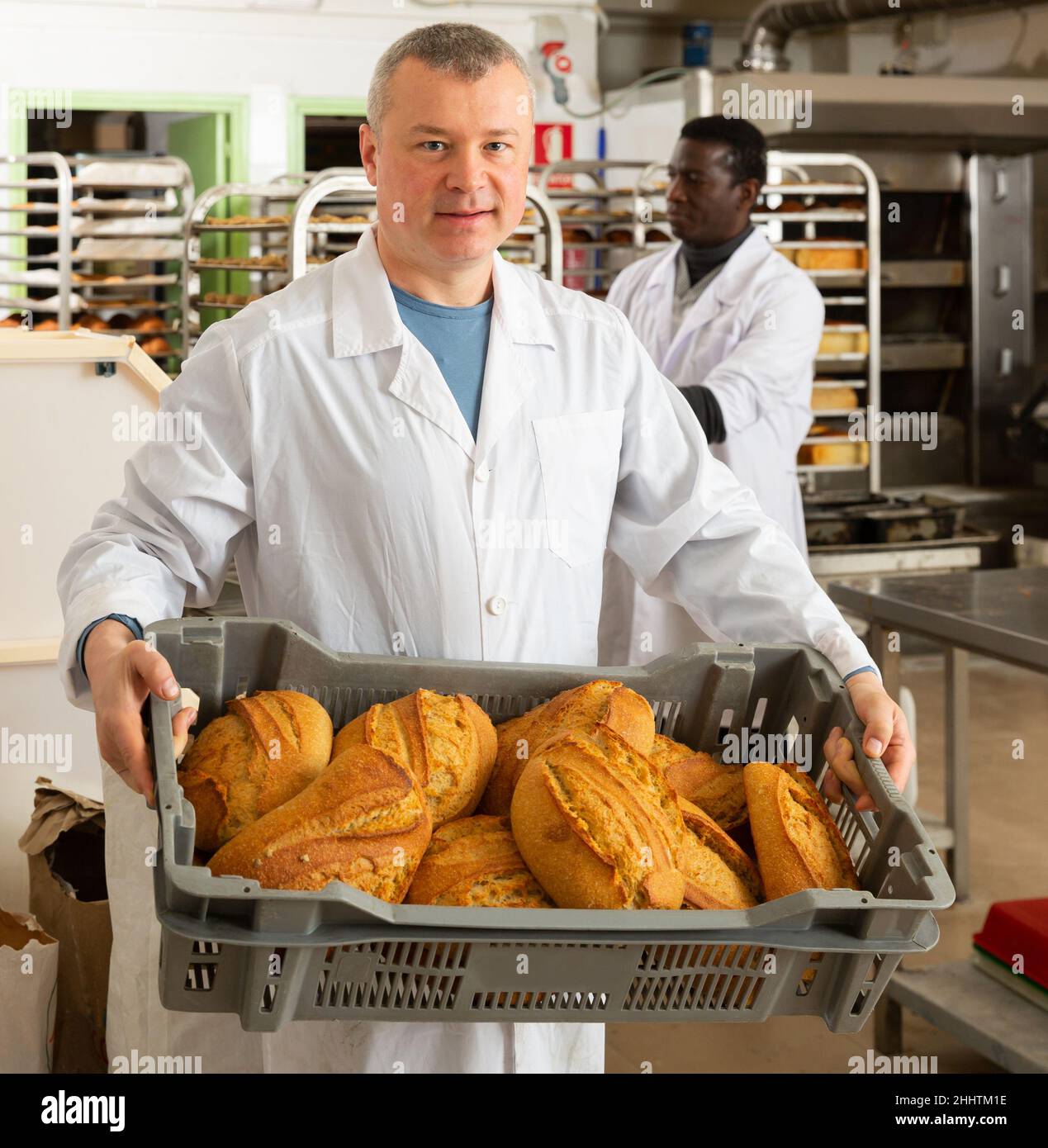 Successful baker during daily work in bakeshop Stock Photo - Alamy