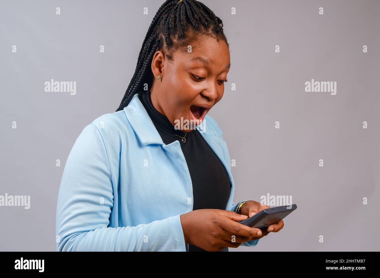 lady got surprised about the result she got her calculator Stock Photo ...