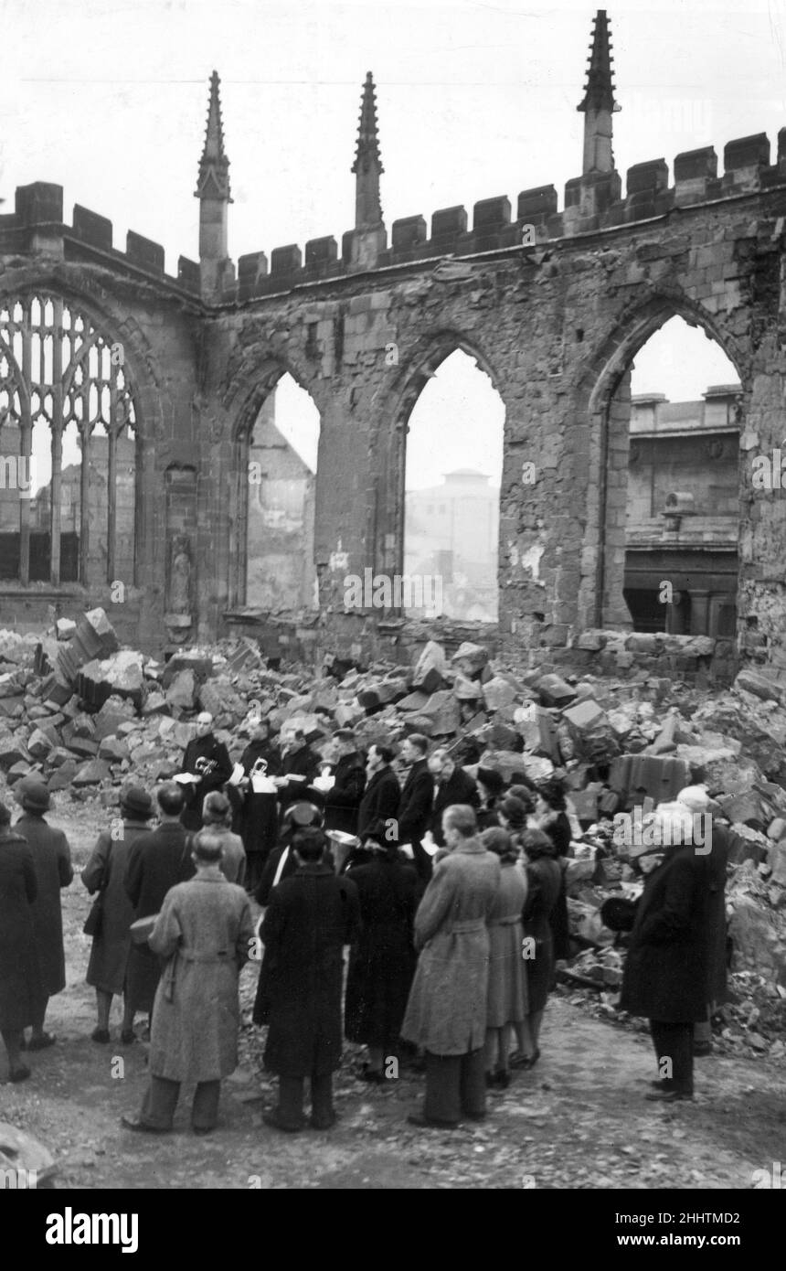 Crowds gather for a service inside the ruins of Coventry Cathedral ...